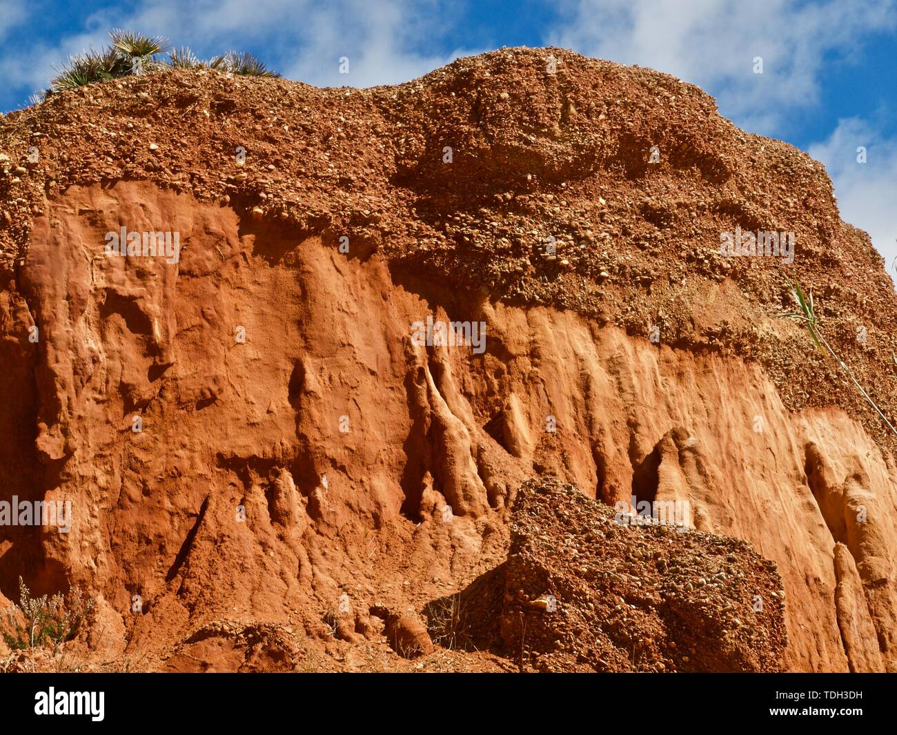 Red high cliffs and wild nature at Paraia da Falesia, a famous paradise ...