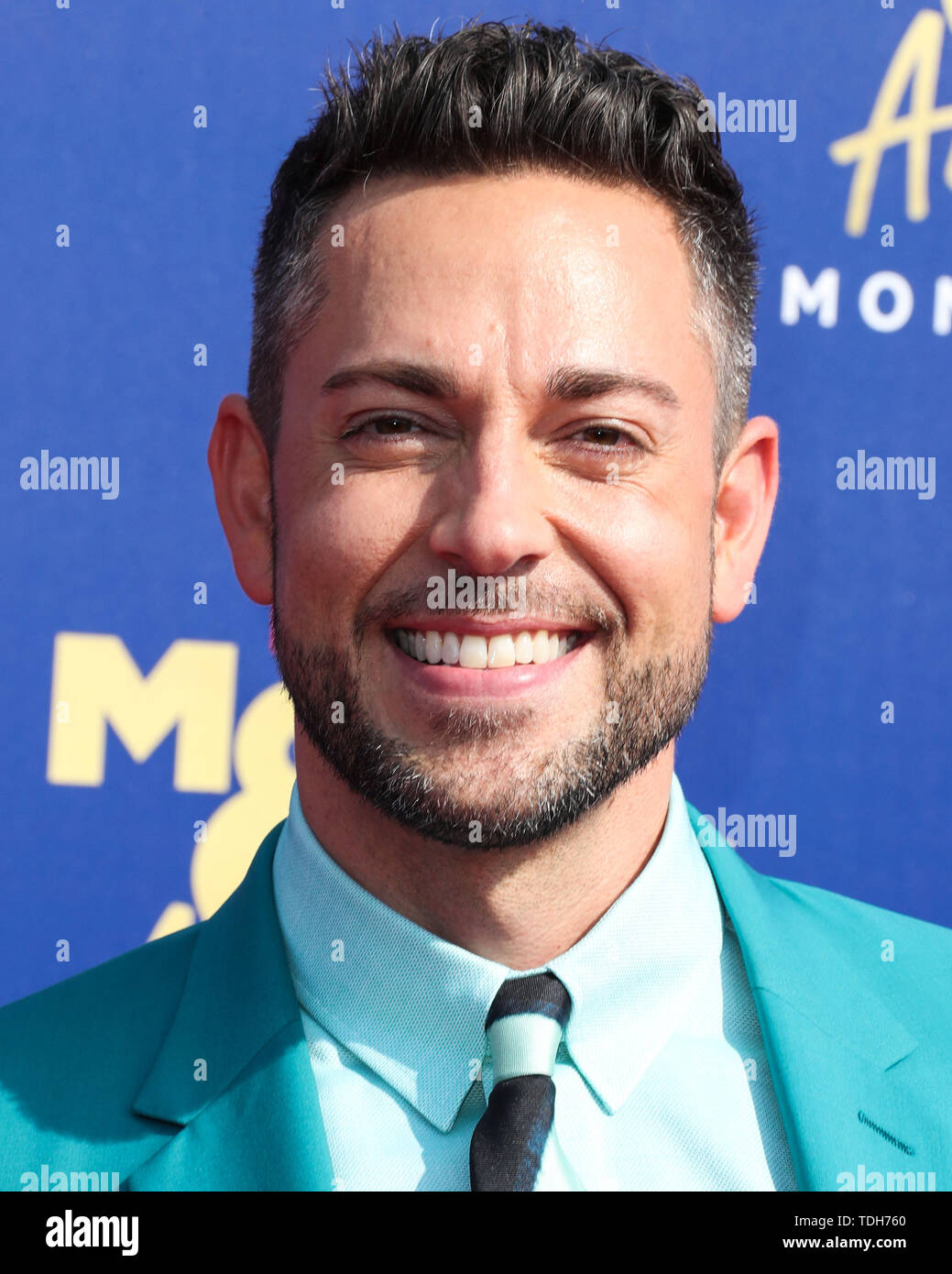 Actor Zachary Levi wearing a Paul Smith suit, Anto shirt, Christian ...