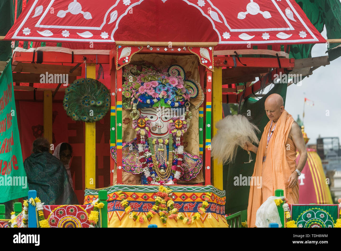 London, UK. 16th June 2019. Hare Krishna followers tow three huge decorated chariots from Hyde ...