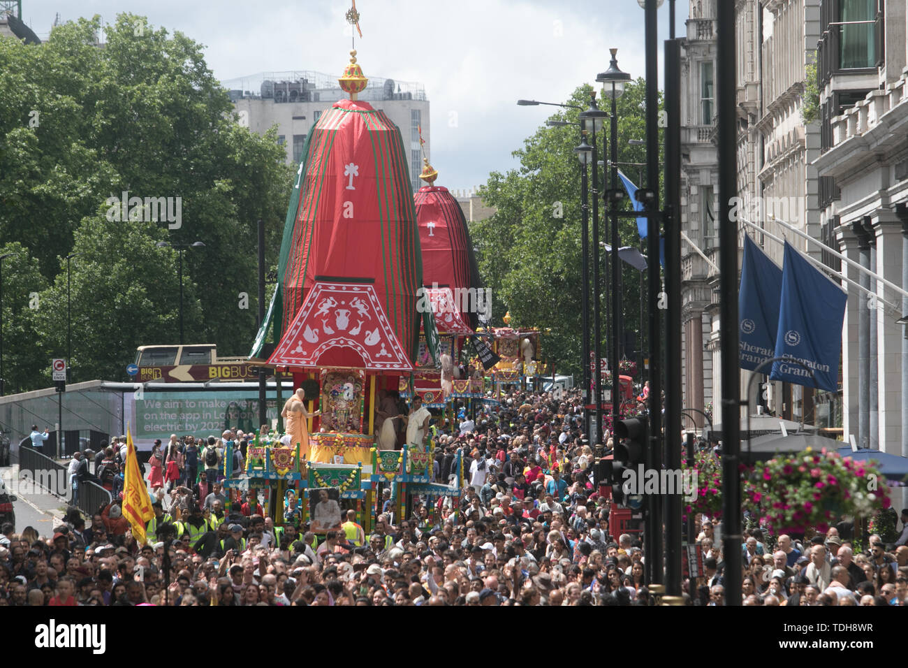 London, UK. 16th June 2019. Hare Krishna followers tow three huge decorated chariots from Hyde ...