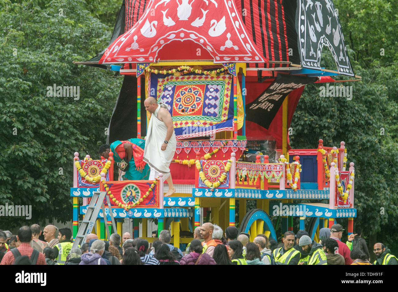London, UK. 16th June 2019. Hare Krishna followers tow three huge decorated chariots from Hyde ...
