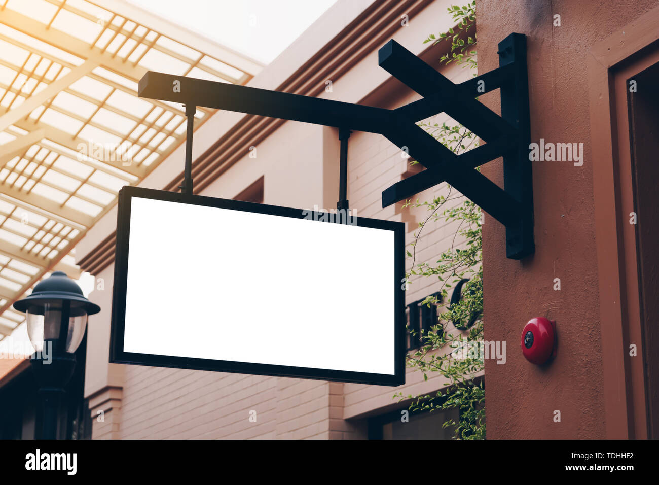 Empty signage and blank mock up hanging on street with copy space Stock ...