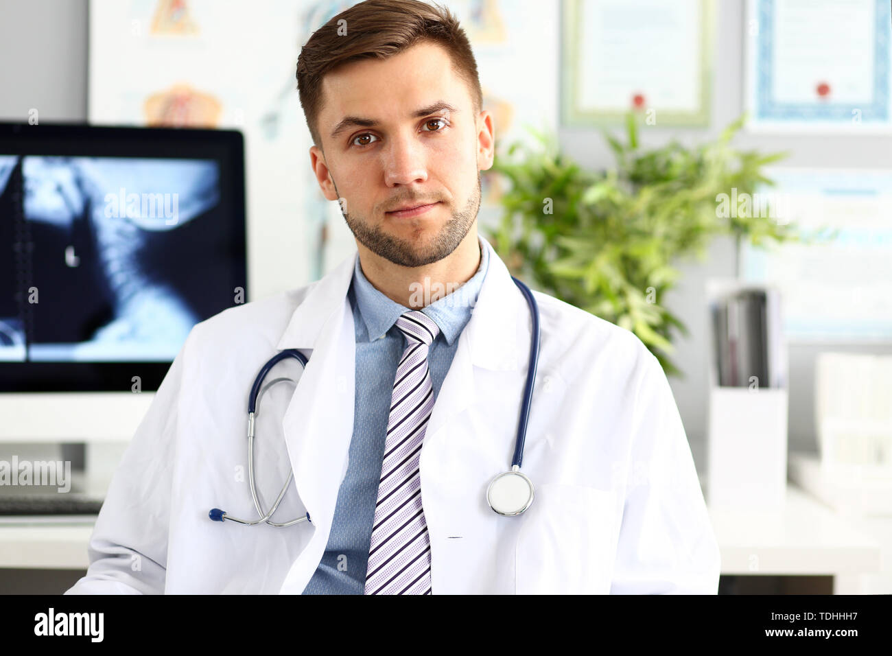 Young serious doctor Stock Photo - Alamy