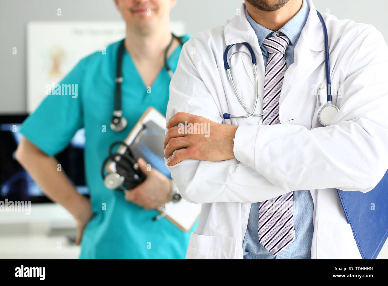 Doctors together in clinic cabinet Stock Photo - Alamy