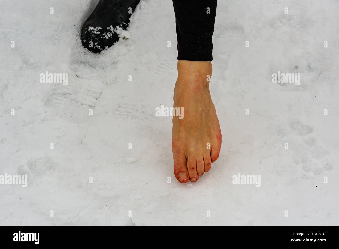 human feet standing on the sand or ground soil in nature textured ...