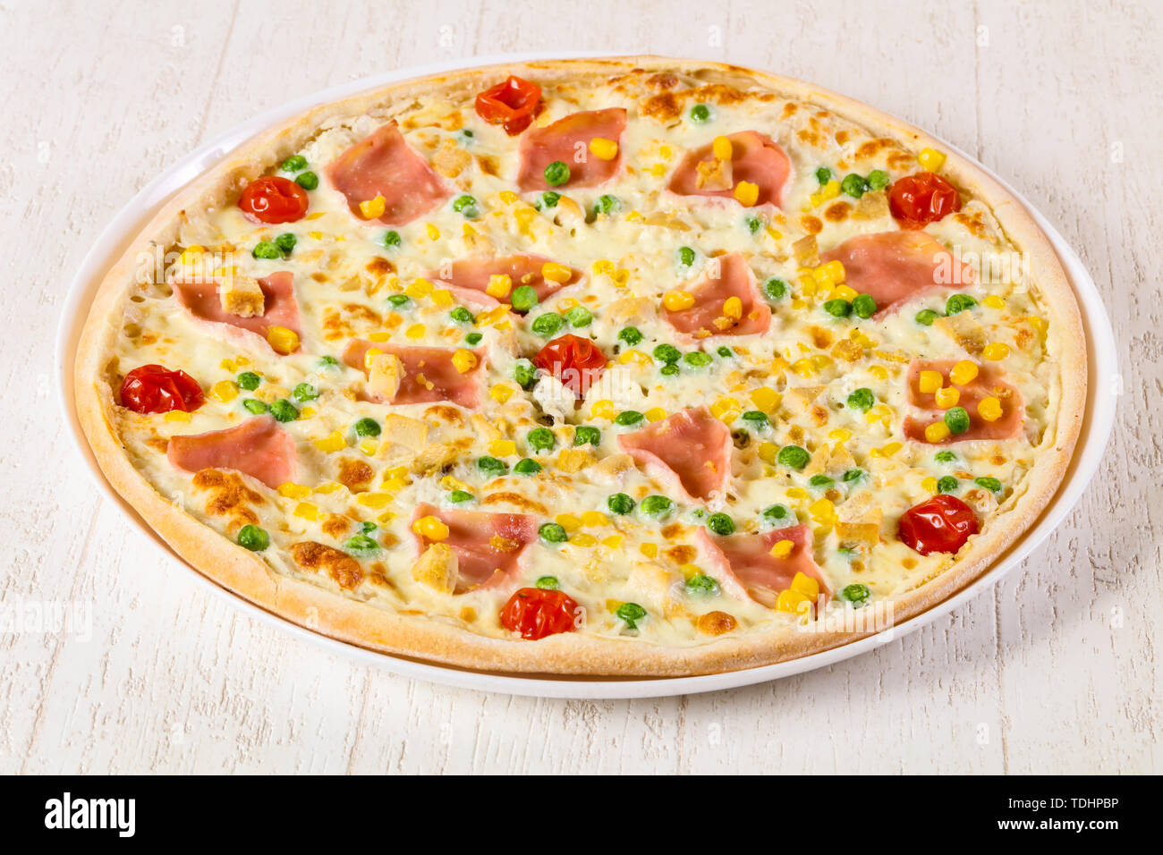 Pizza with ham and cheese Stock Photo - Alamy