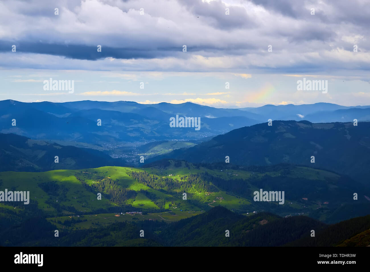 Bright rolling countryside around a farm in the morning light ...