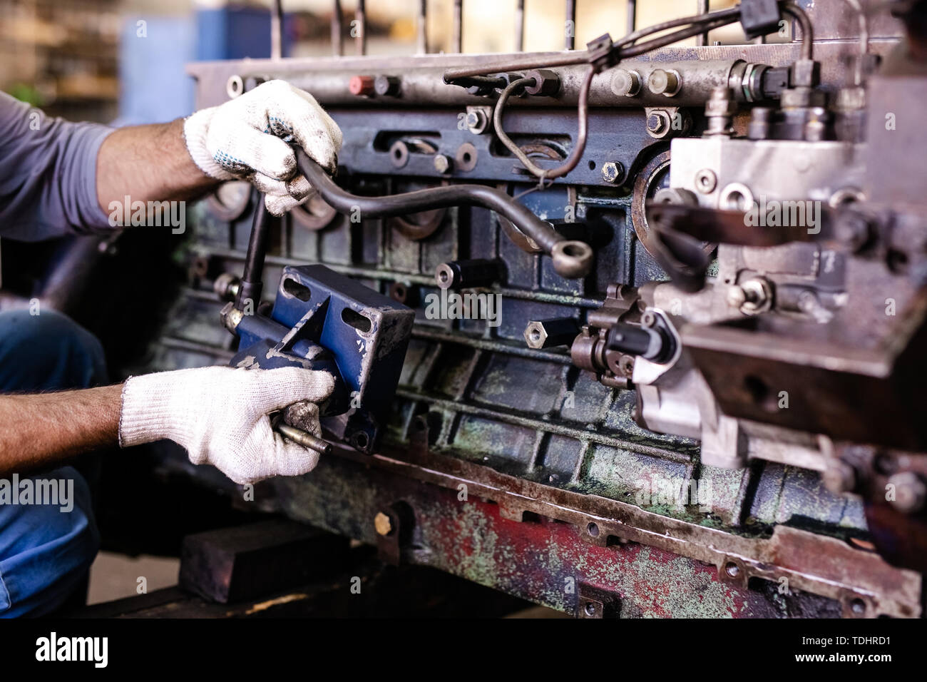 Mechanic opened the locking valve mechanism. Disassemble engine block ...