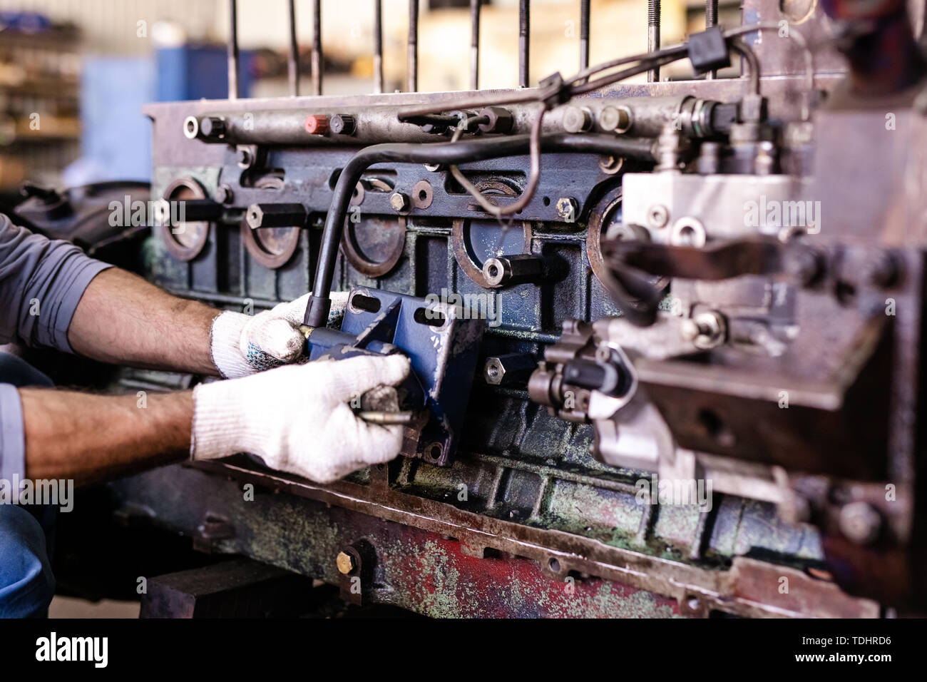 Mechanic opened the locking valve mechanism. Disassemble engine block ...