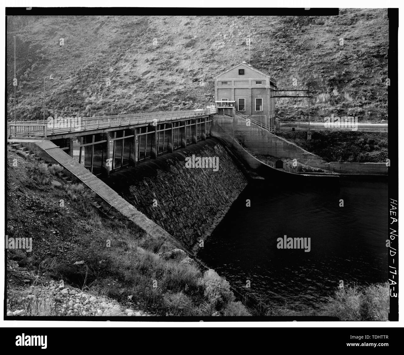 OVERALL VIEW OF DOWNSTREAM FACE OF DAM, WITH SPILLWAY IN LEFT ...