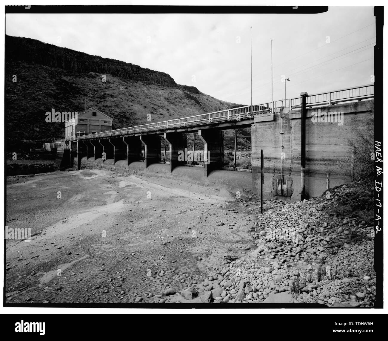 OVERALL VIEW OF UPSTREAM FACE OF DAM, WITH SPILLWAY IN CENTER ...