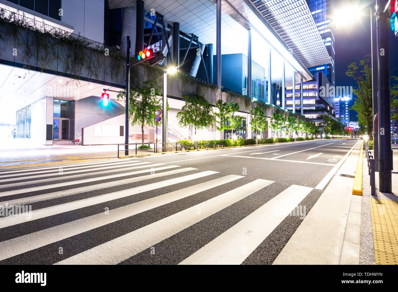 traffic on road intersection in downtown of tokyo at night Stock Photo ...