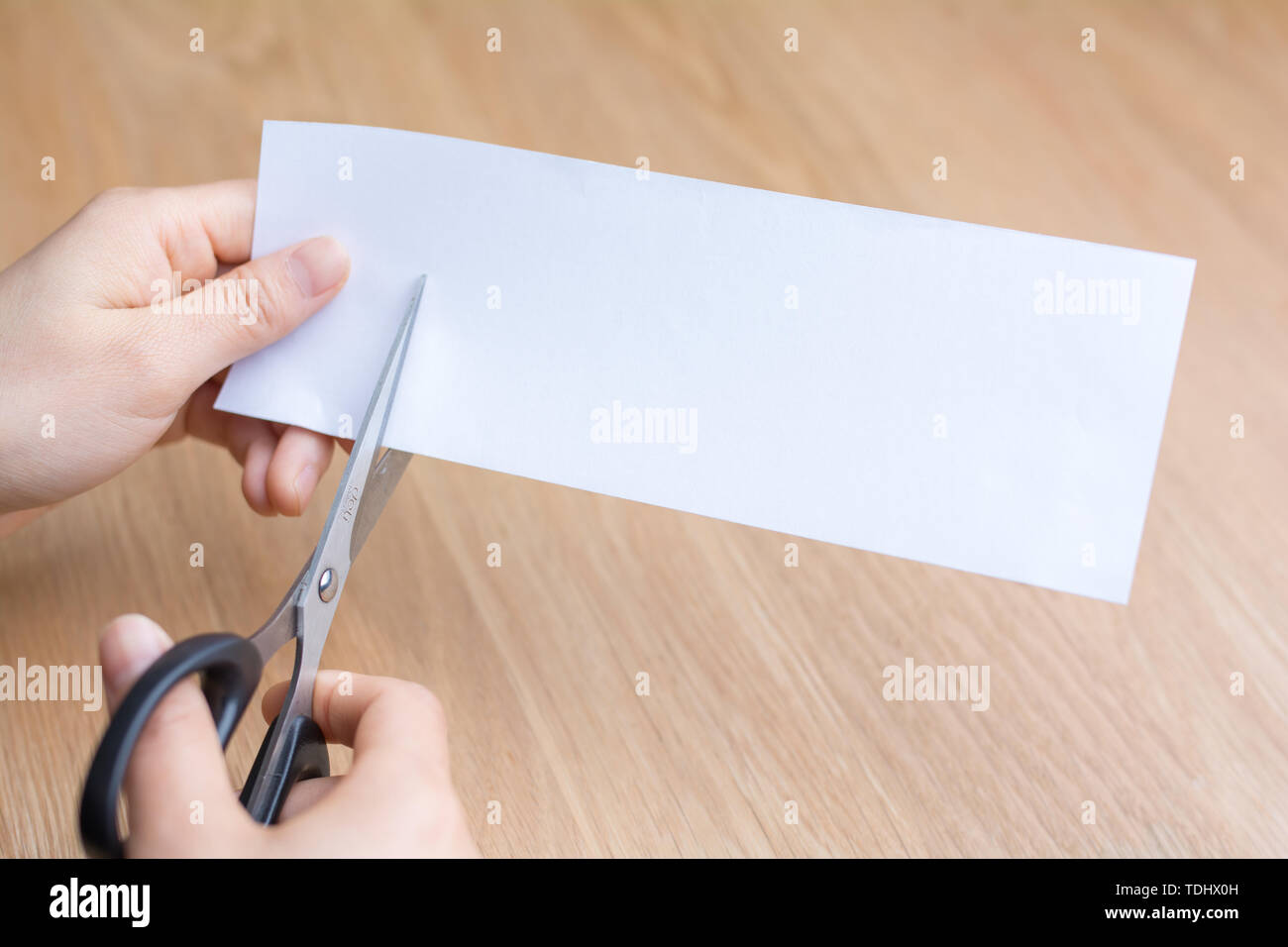 woman cutting white paper Stock Photo - Alamy