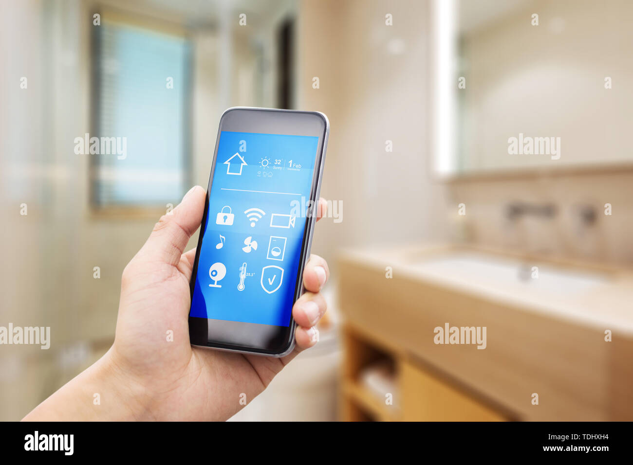 Mobile phone in smart home Stock Photo - Alamy