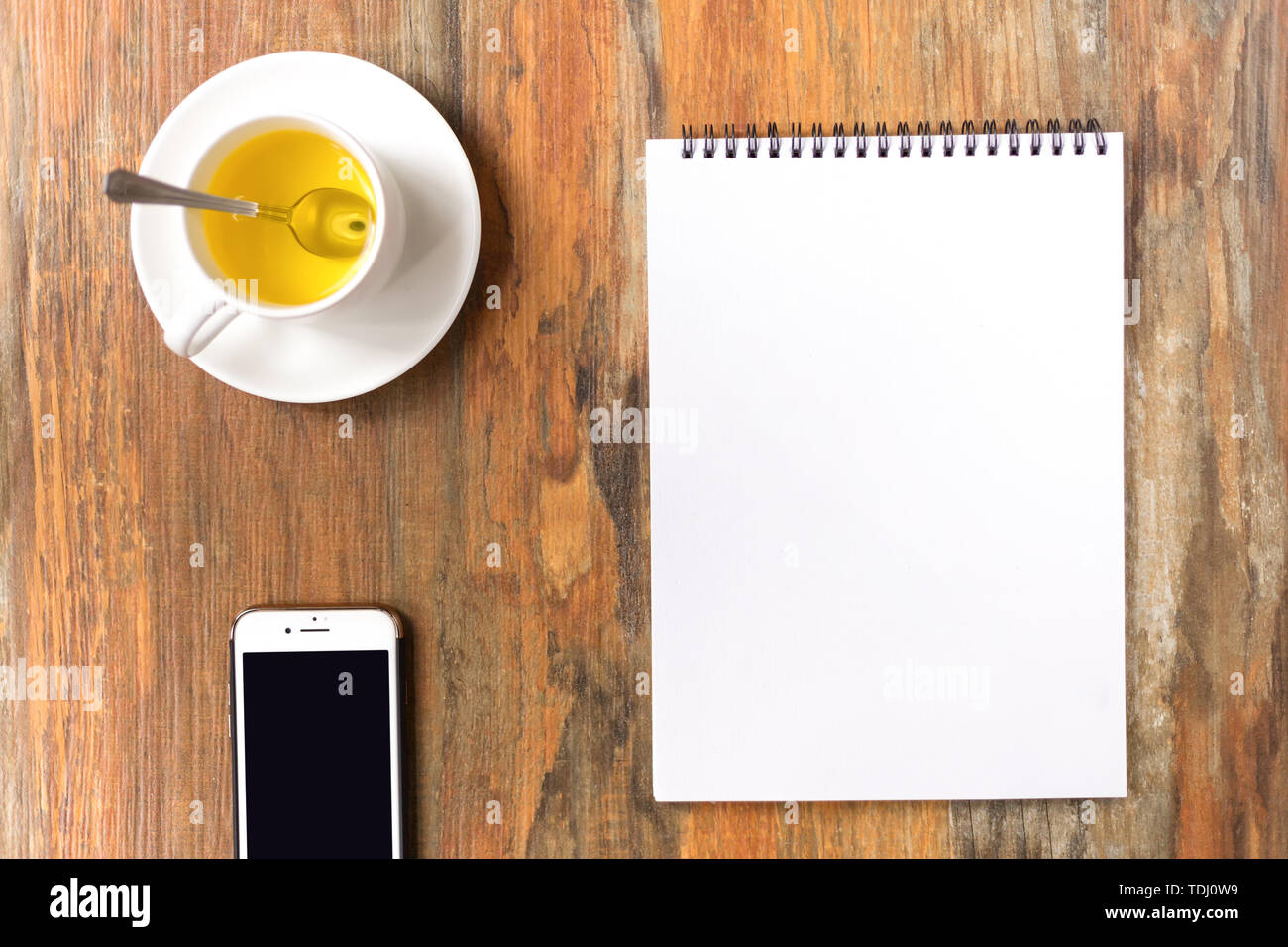 Blank notebook on your desk Stock Photo - Alamy