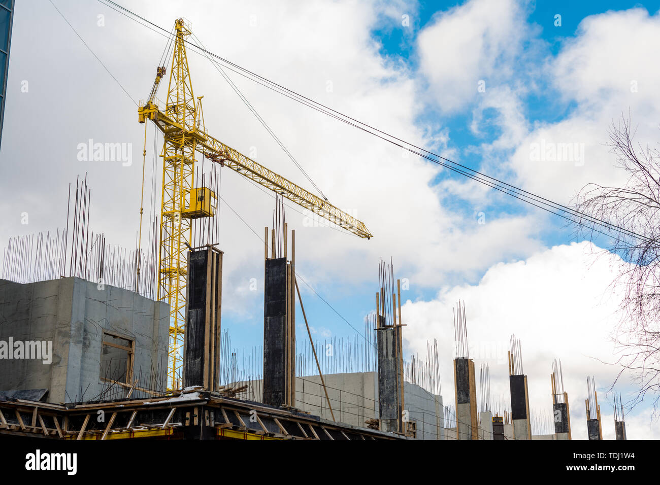 The process of building a multi-storey residential building, a yellow ...