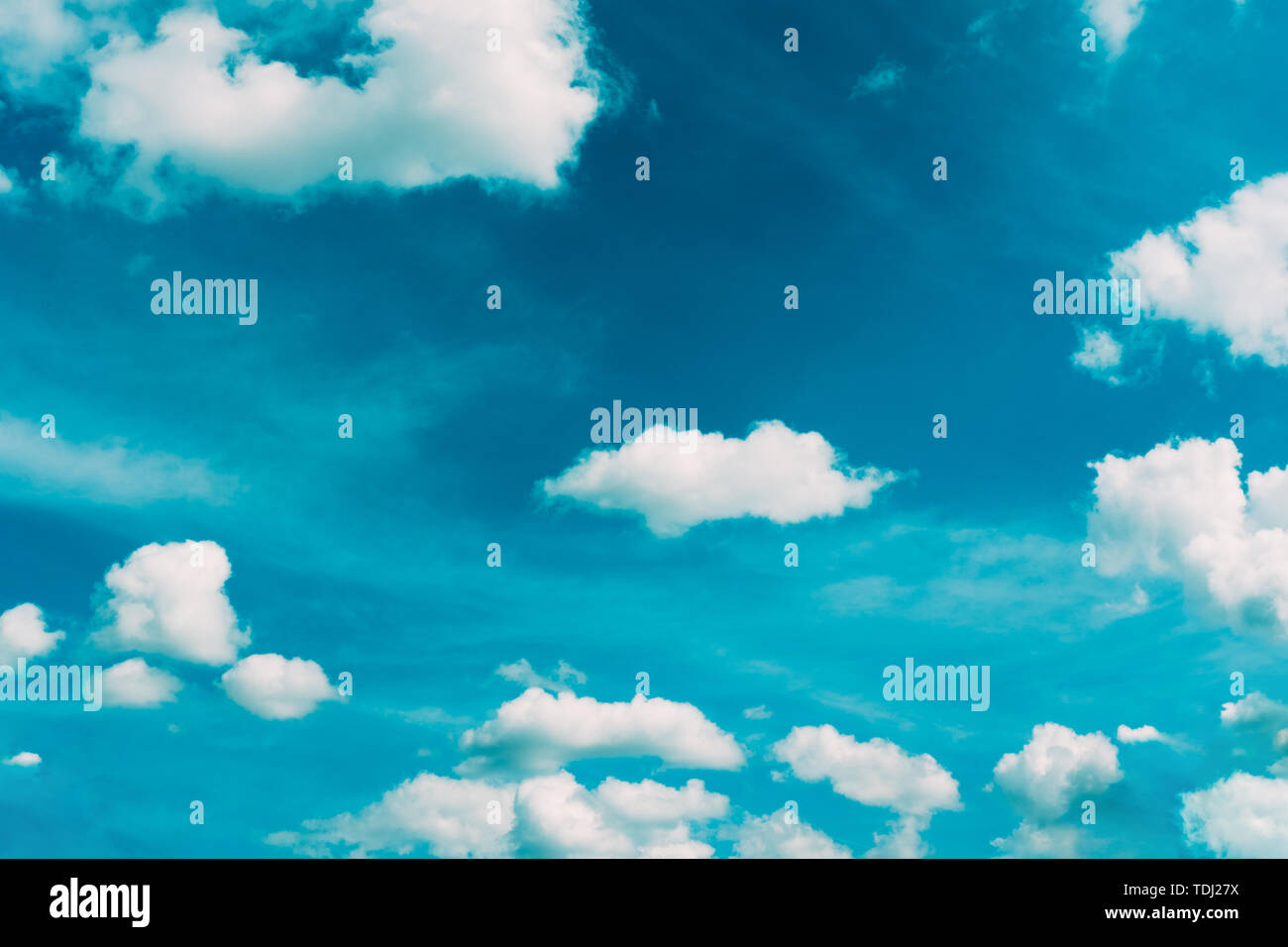 White clouds in turquoise sky background. Summertime cloudscape ...