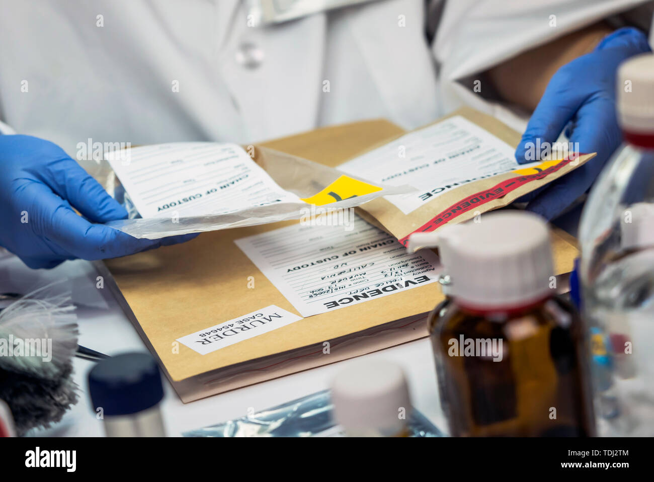 Police Scientific comparing evidence of a crime in the laboratory ...