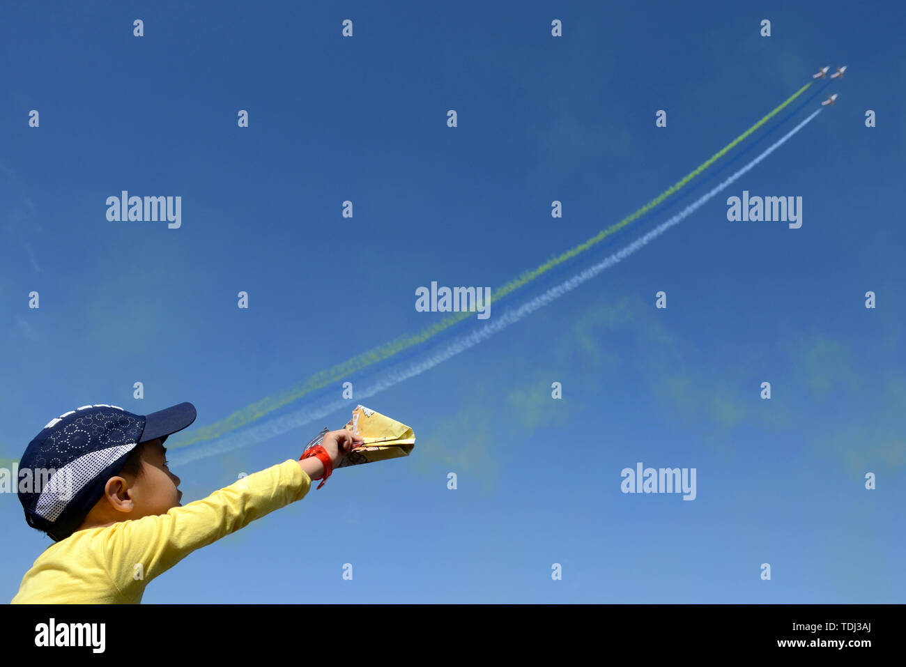 Boy flying paper airplane hi-res stock photography and images - Alamy