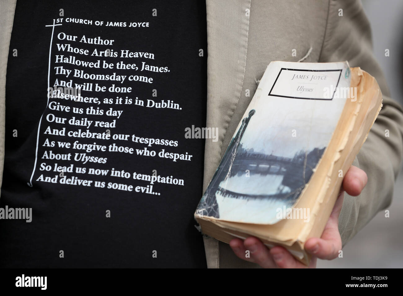 A man holds a copy of Ulysses at the annual Bloomsday event at ...