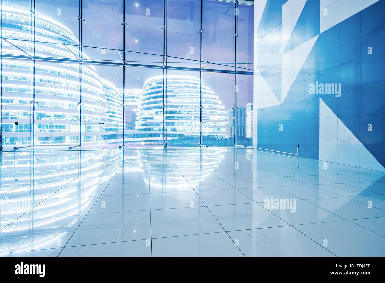 night scene of modern buildings through windows Stock Photo - Alamy