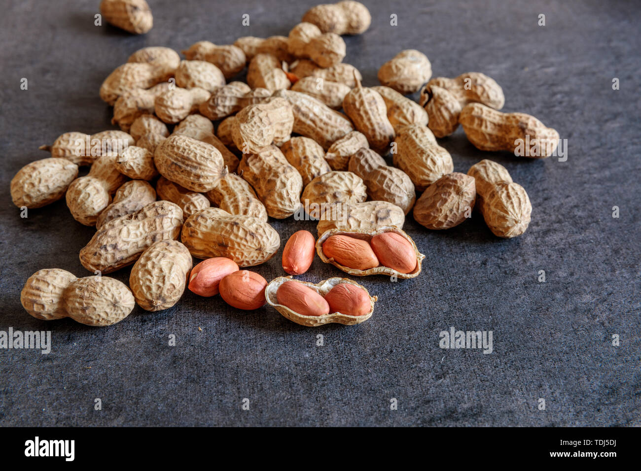 There's a lot of peanuts on the table Stock Photo - Alamy