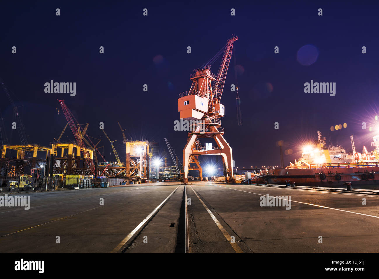 Night view of ship repair shop Stock Photo - Alamy