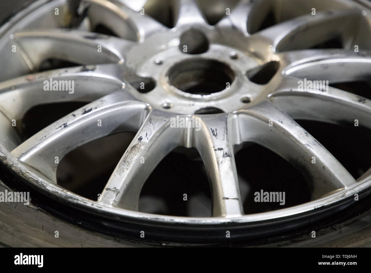 old and battered wheel from the car Stock Photo - Alamy