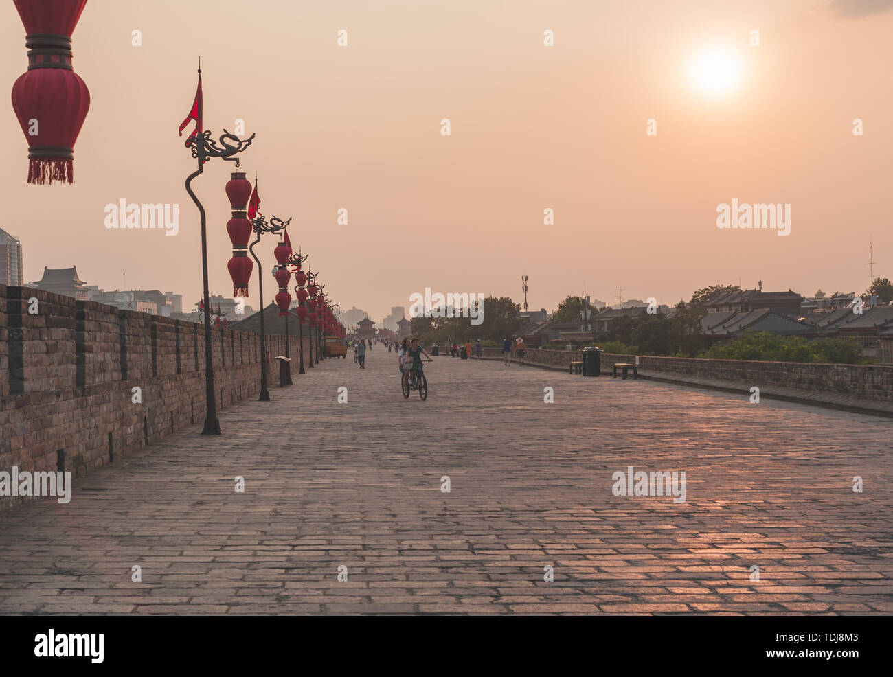 Sunset on the ancient city walls of Xi'an Stock Photo - Alamy