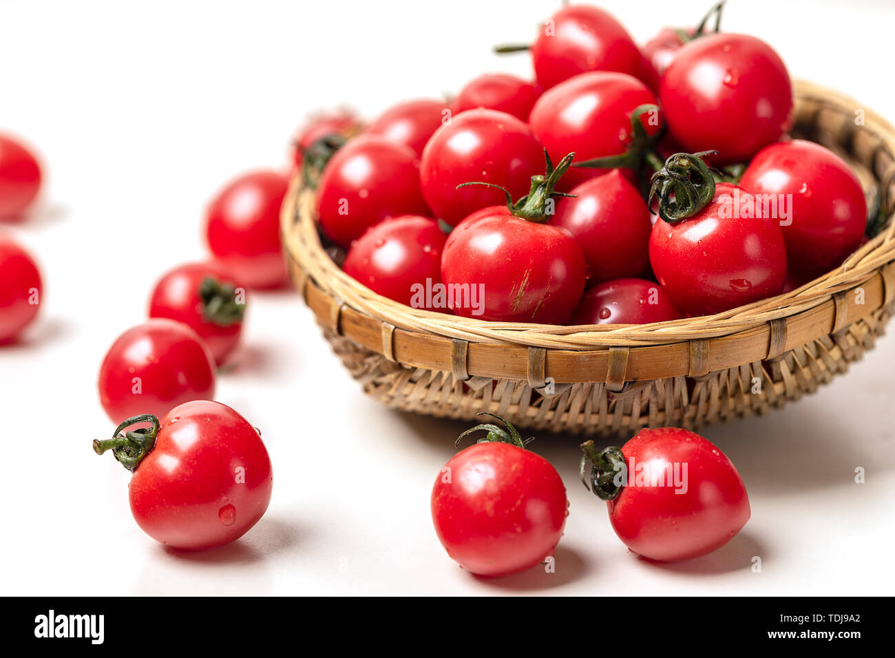 Tomatoes on a white background, sage fruit Stock Photo - Alamy
