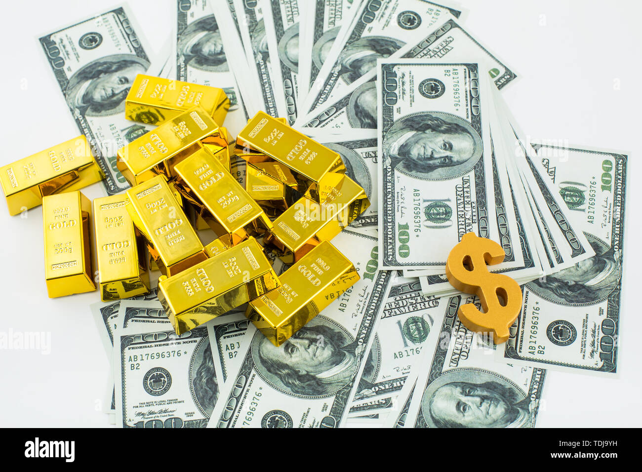 Gold and dollars Stock Photo - Alamy