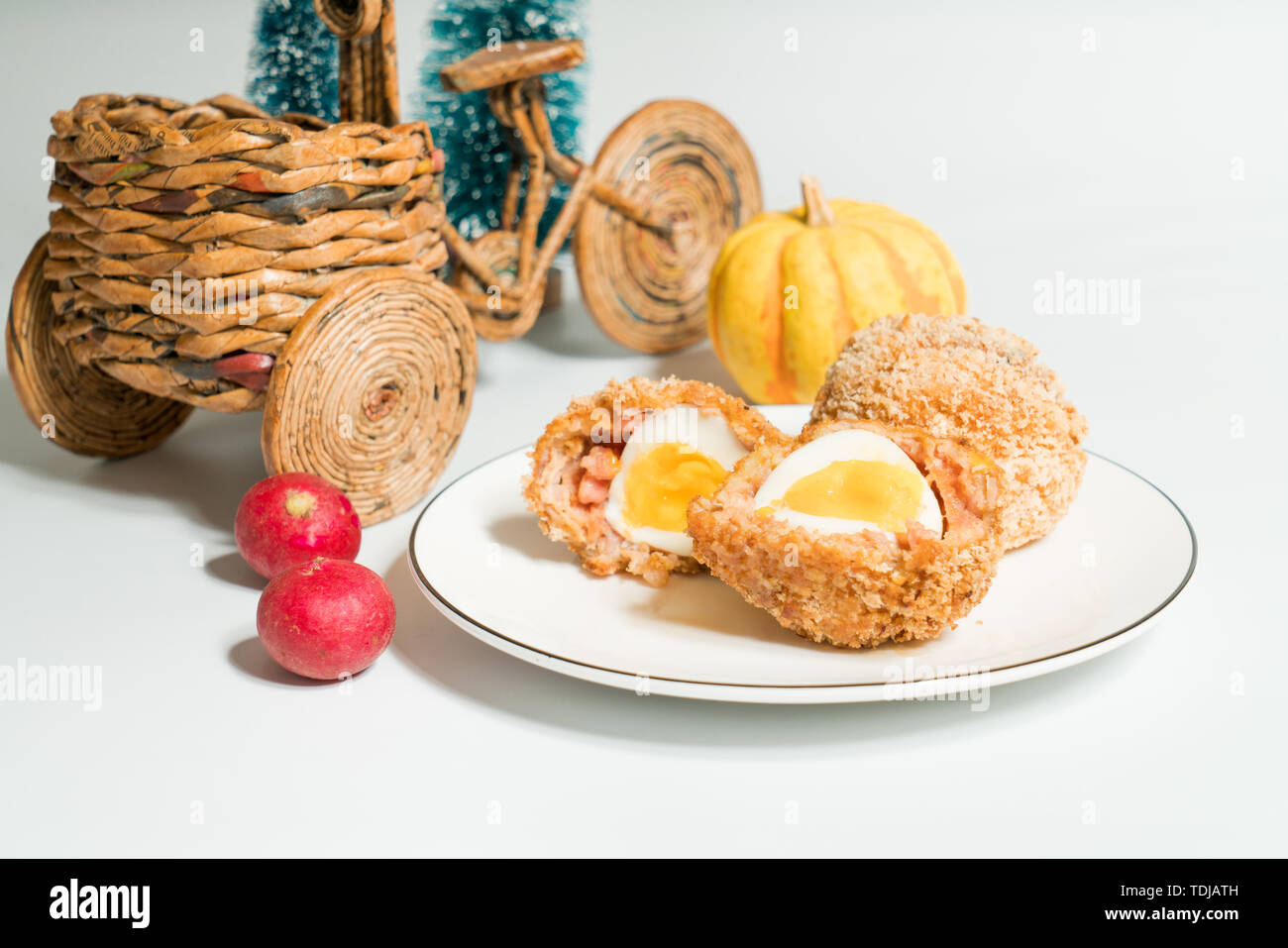 Scottish egg pendulum plate with white background Stock Photo - Alamy