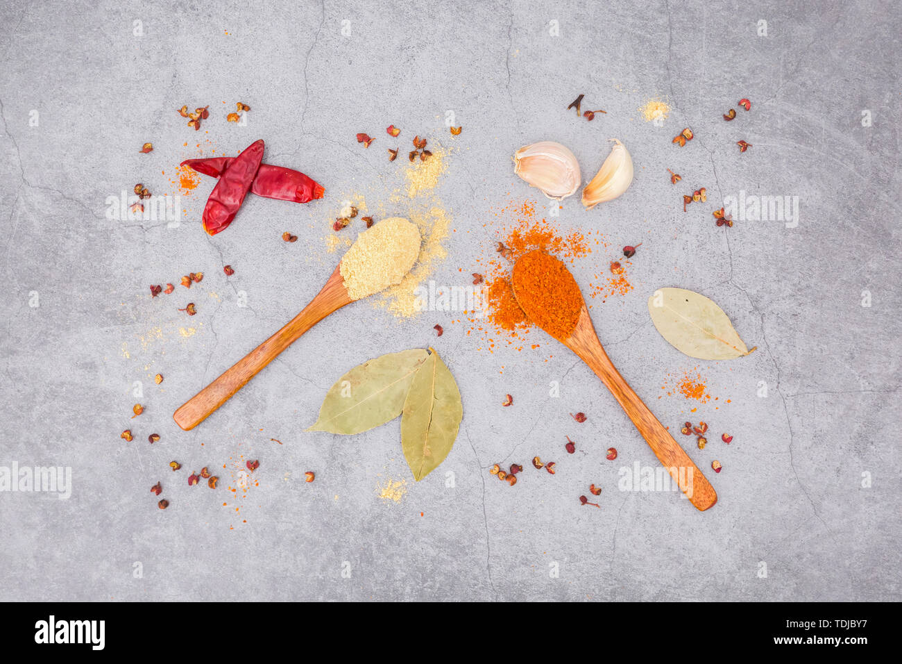 Multiple wooden spoons filled with various seasonings Stock Photo - Alamy