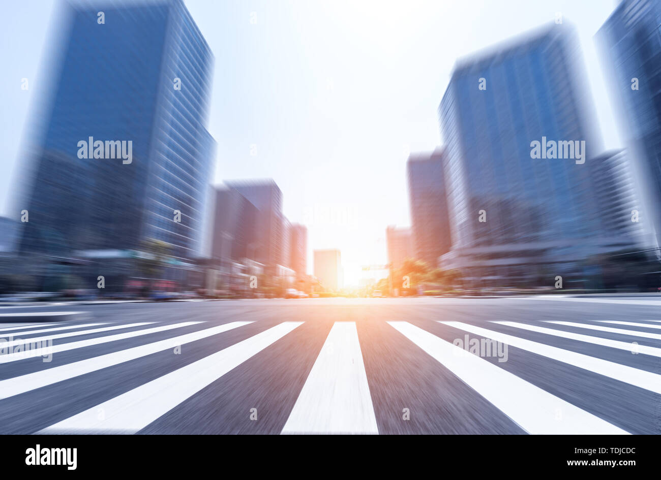 traffic on road intersection near modern office buildings at sun Stock ...