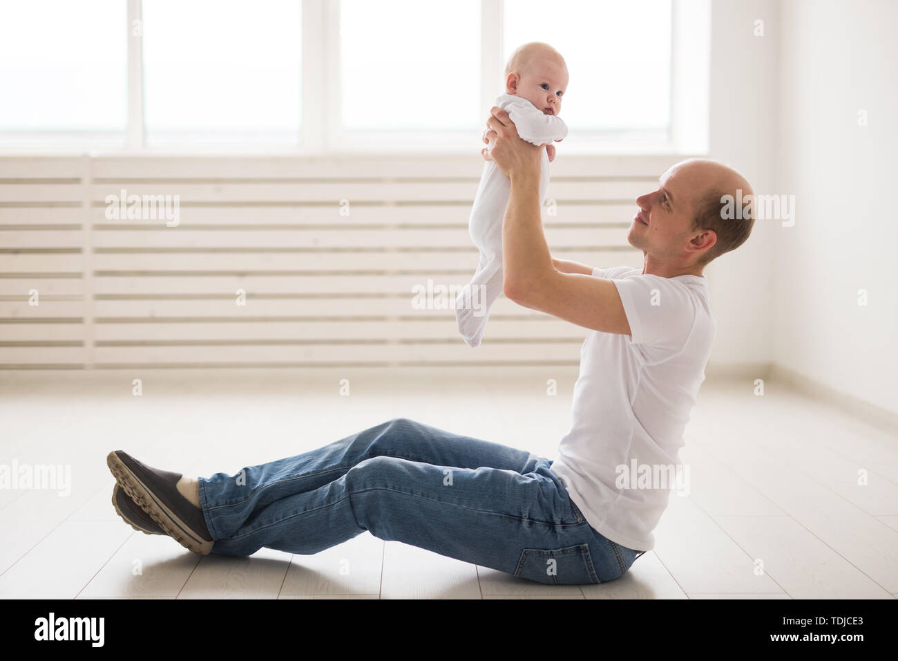 Children, family and fatherhood concept - happy bald father holding ...