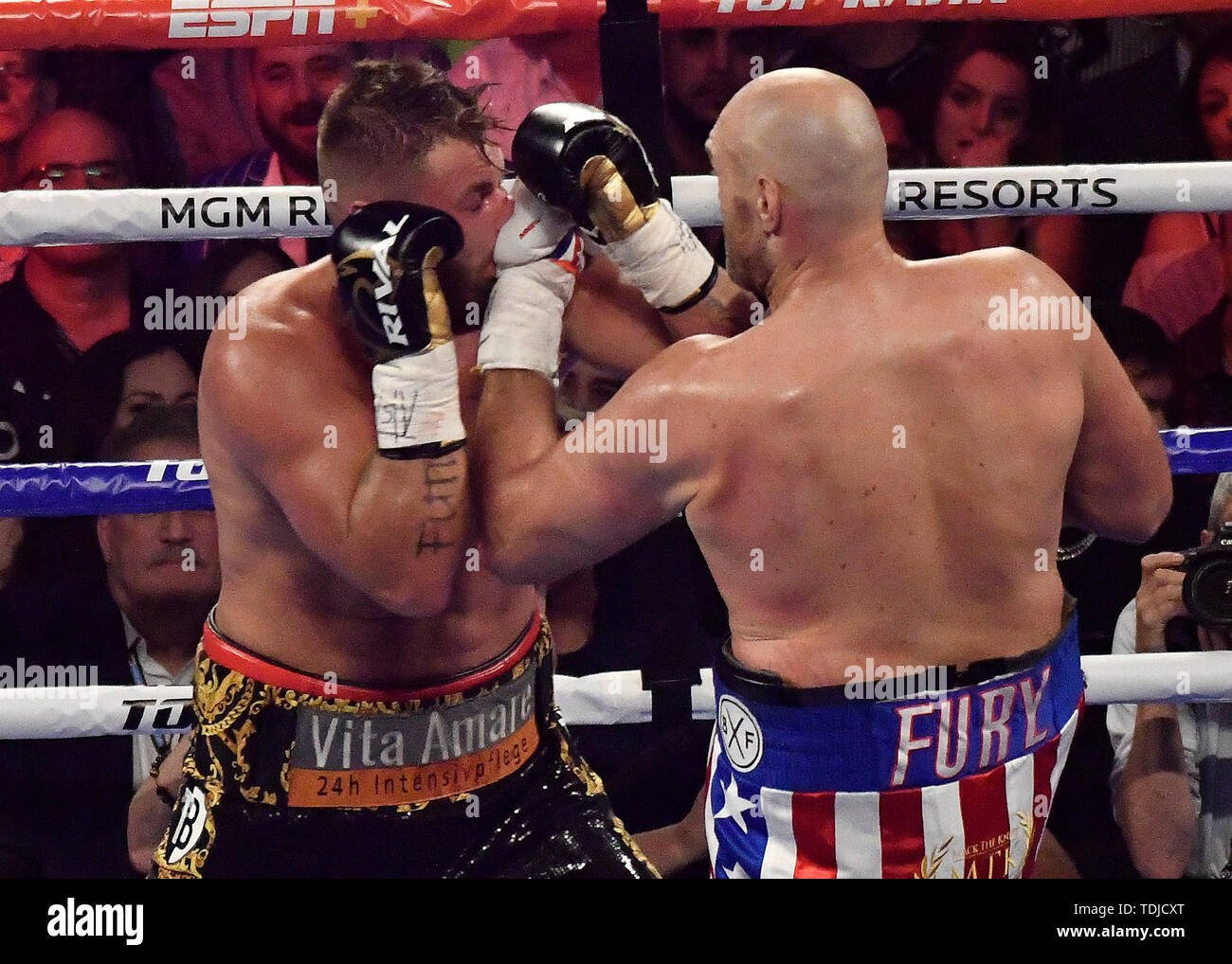 LAS VEGAS, NEVADA - JUNE 15: Boxer Tyson Fury(R) hits Tom Schwarz ...
