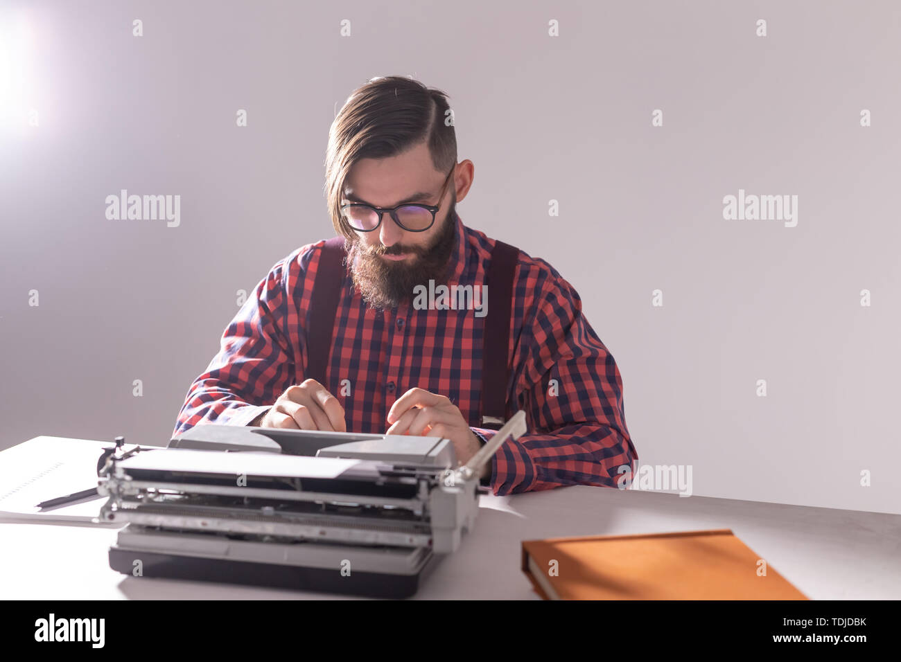 people, writer and hipster concept - young stylish writer working on ...