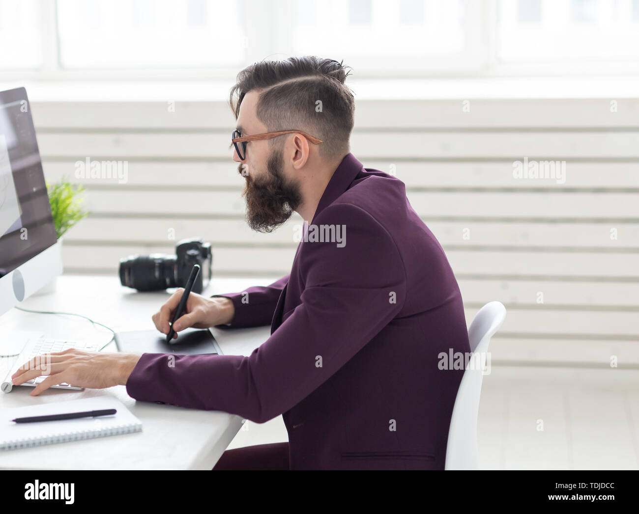 people, design and style concept - graphic designer sketching new ...