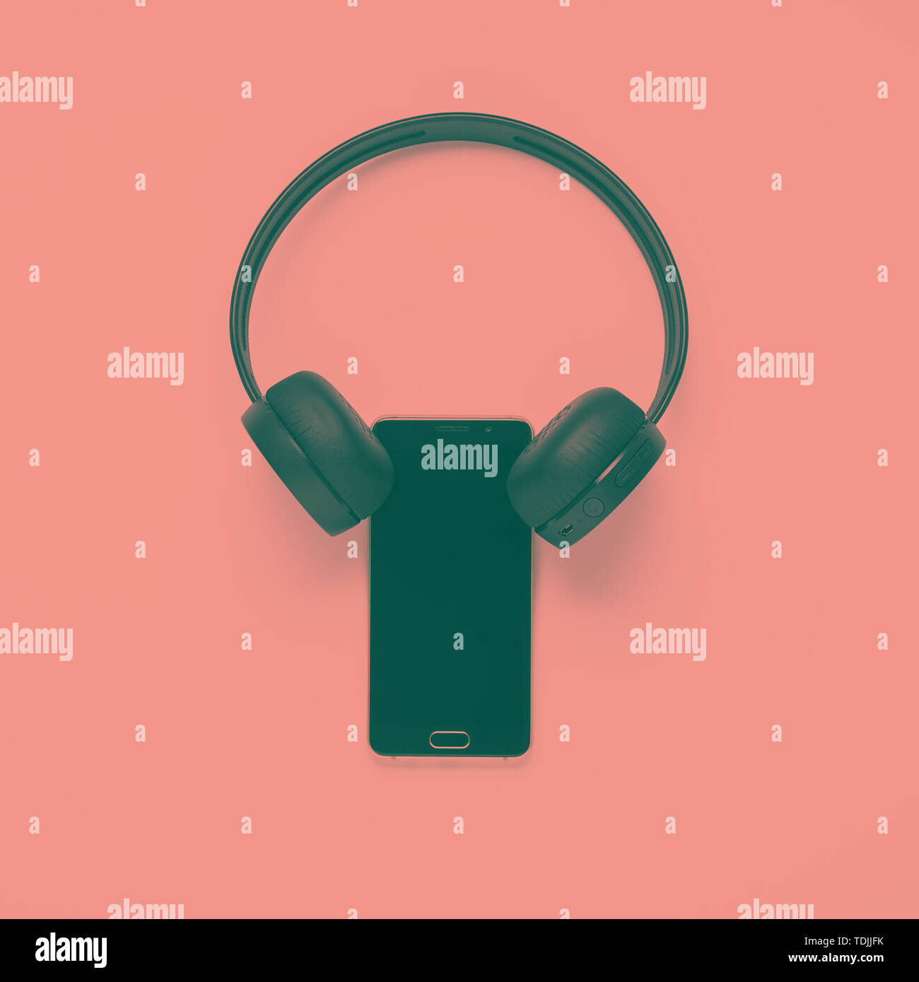 pop art duotone effect. flat lay smartphone with wireless headphones ...