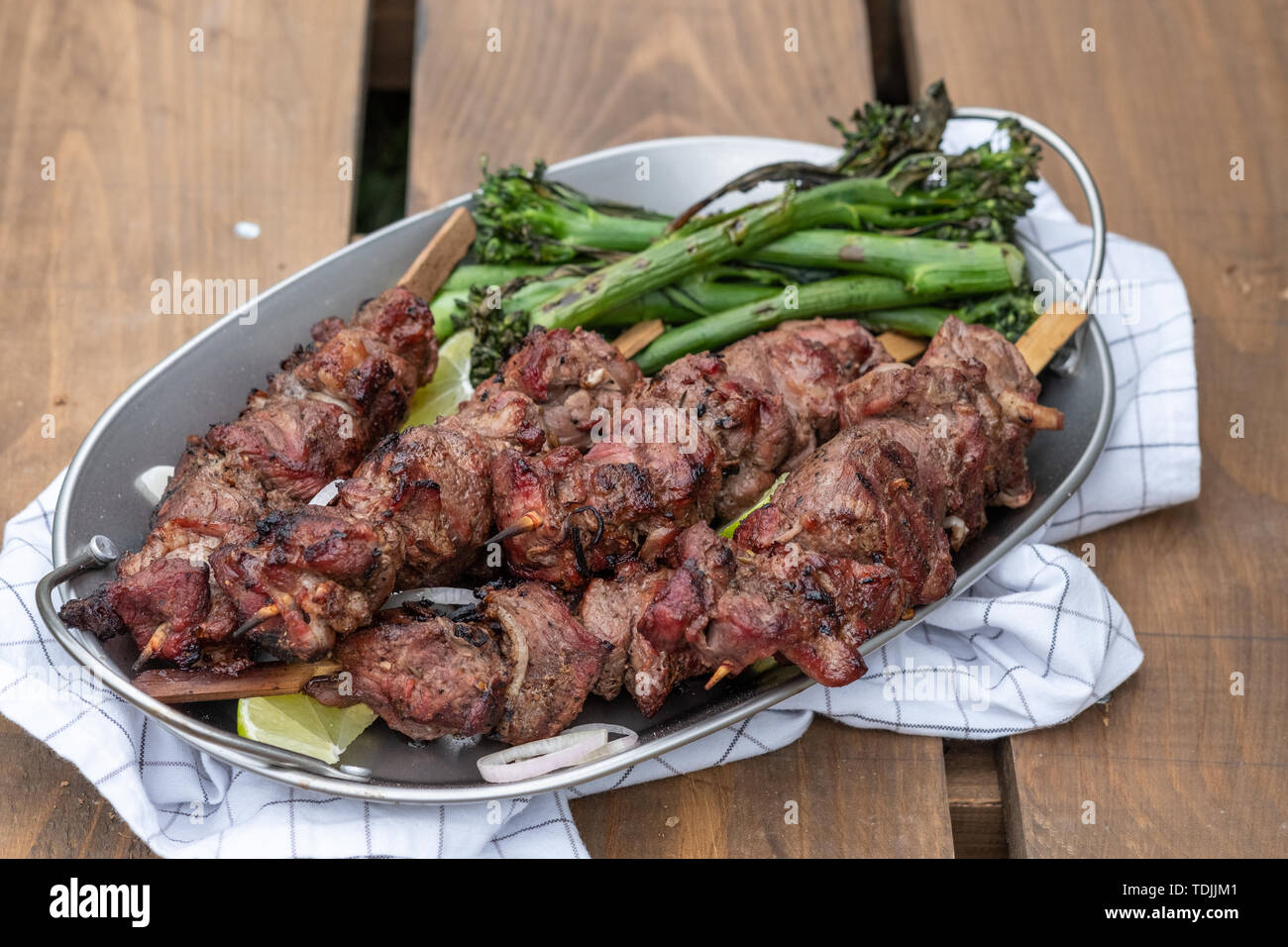 Grilled lamb meat kebabs with green broccolini Stock Photo - Alamy