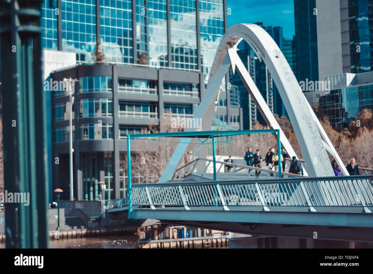 Group of people walking on a bridge with amazing architecture Stock ...