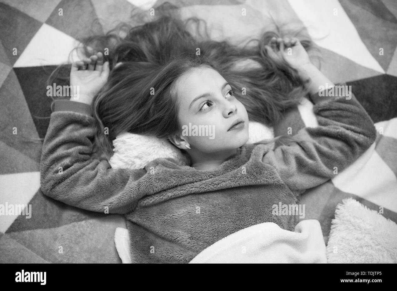 Girl little child relax at home. Evening relaxation before sleep. Child ...