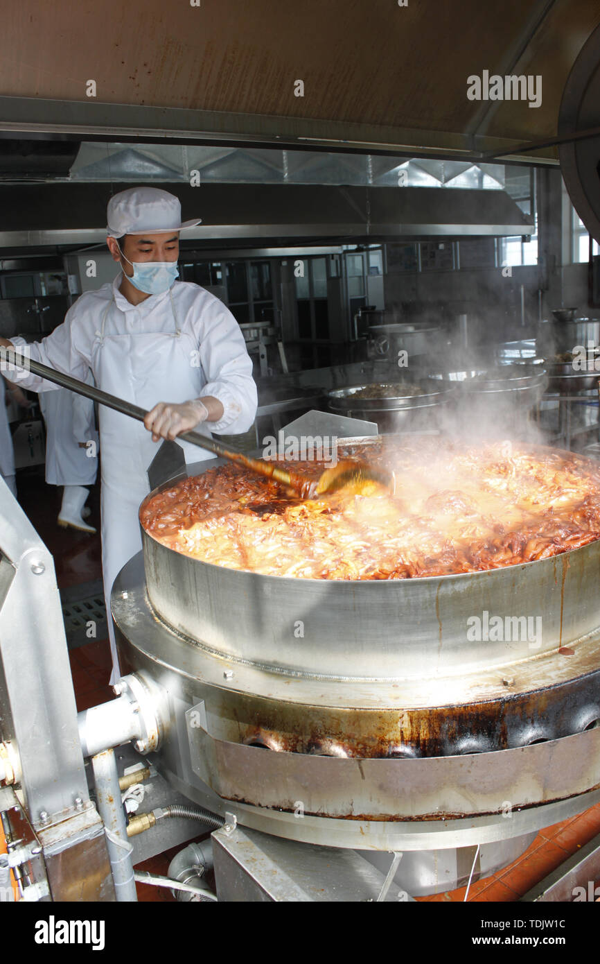 Food stir-frying processing Stock Photo - Alamy