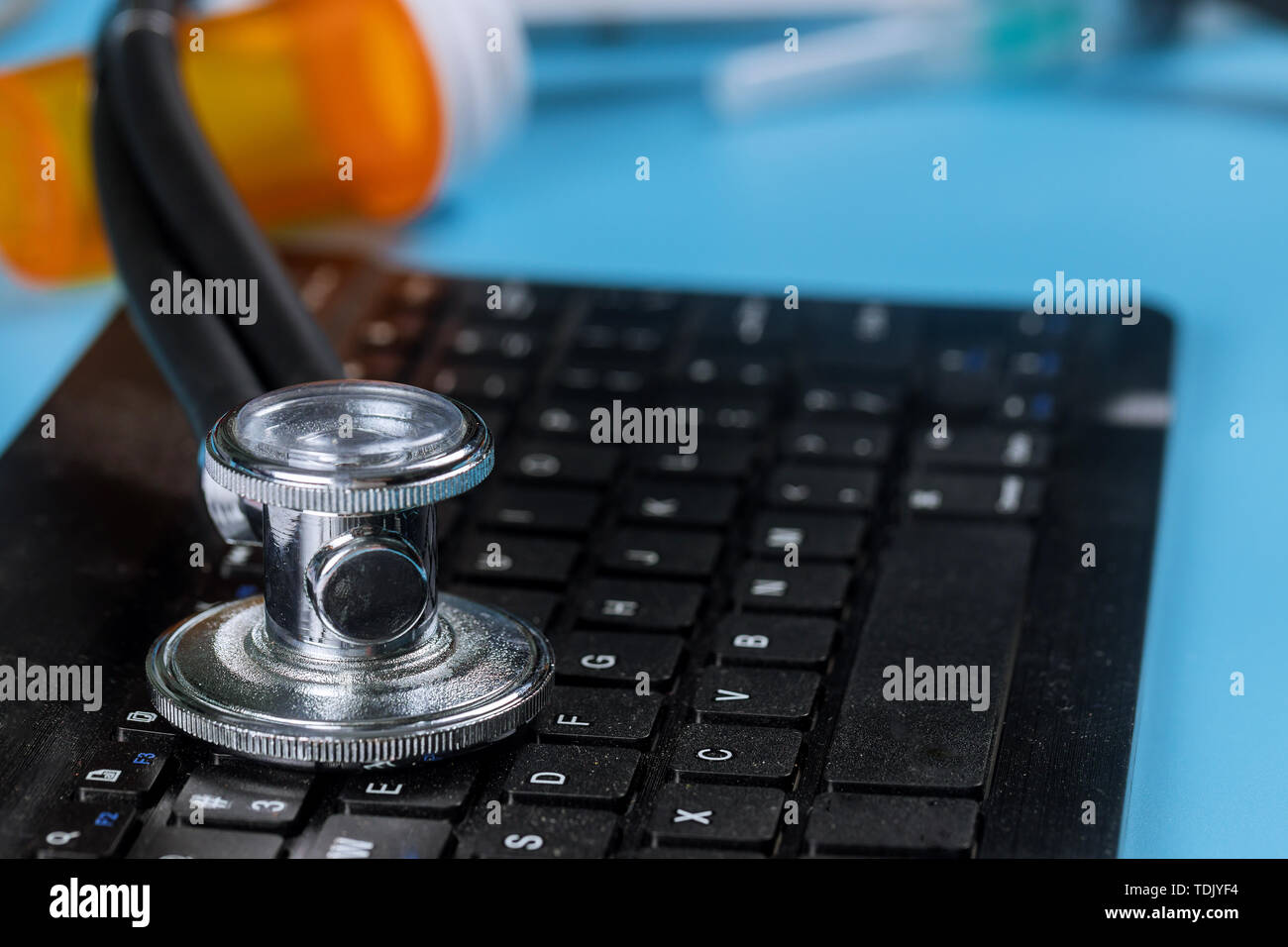 Stethoscope on laptop keyboard diagnosis with medical equipments ...