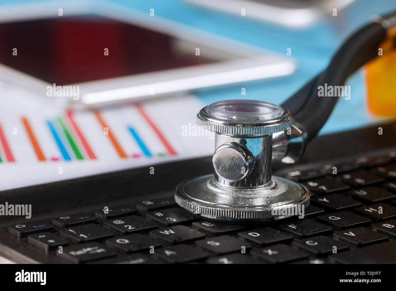 Computer data analysis stethoscope over a laptop computer keyboard ... Computer data analysis stethoscope over a laptop computer keyboard ...