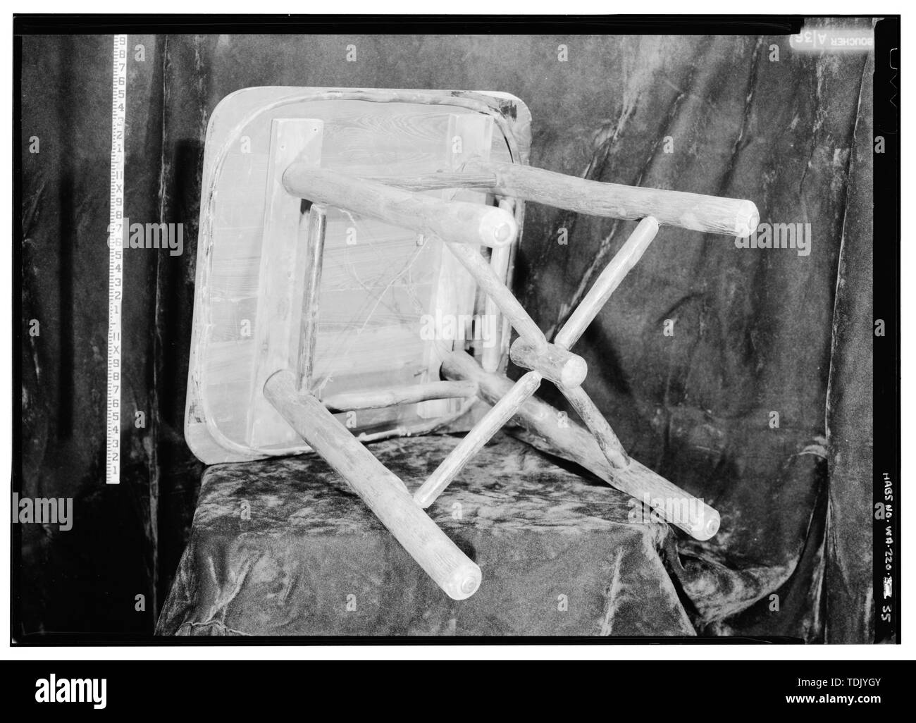 OBJECT PHOTOGRAPH, TABLE ON ITS SIDE EXPOSING REVERSE OF TABLE TOP ...