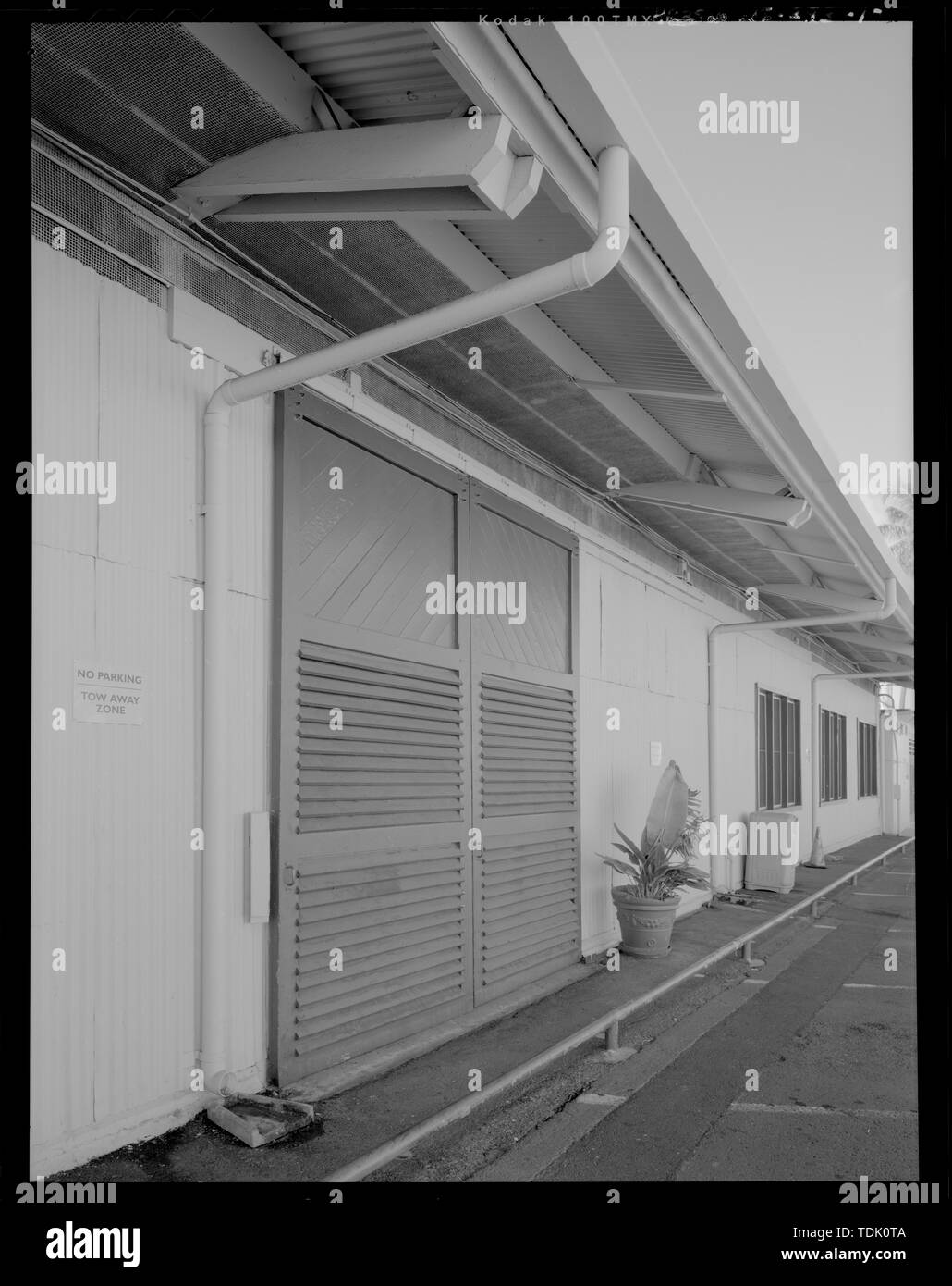 OBLIQUE VIEW OF ORIGINAL SLIDING DOORS WITH LOUVERED AND DIAGONAL BOARD ...