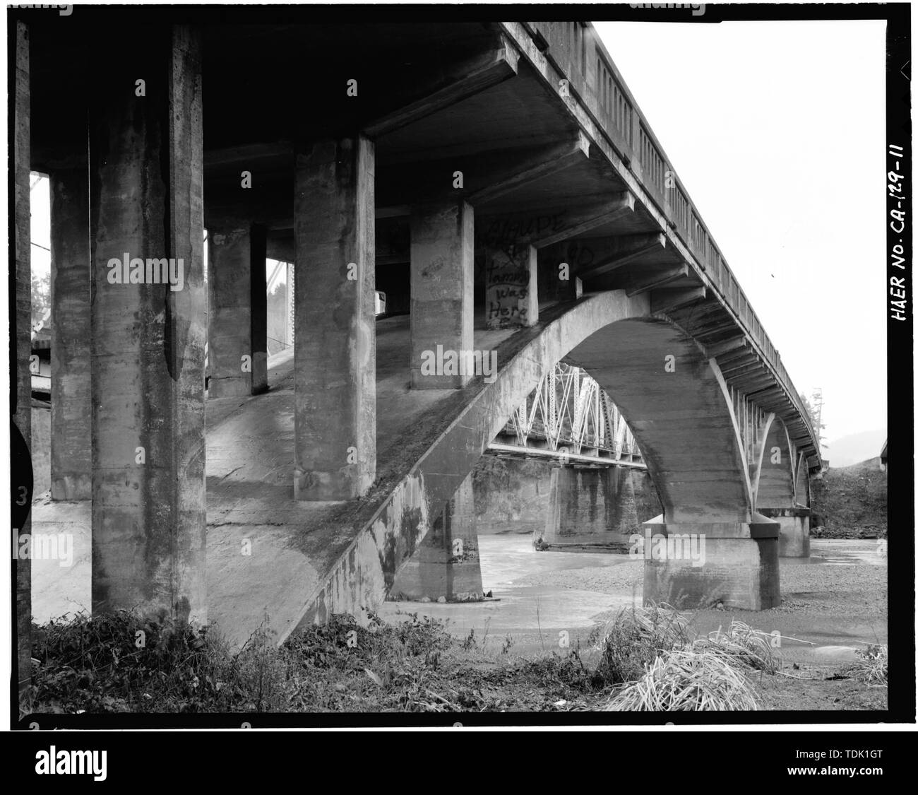 OBLIQUE VIEW SHOWING DOWNSTREAM SIDE OF BRIDGE, LOOKING SOUTH SOUTHWEST ...