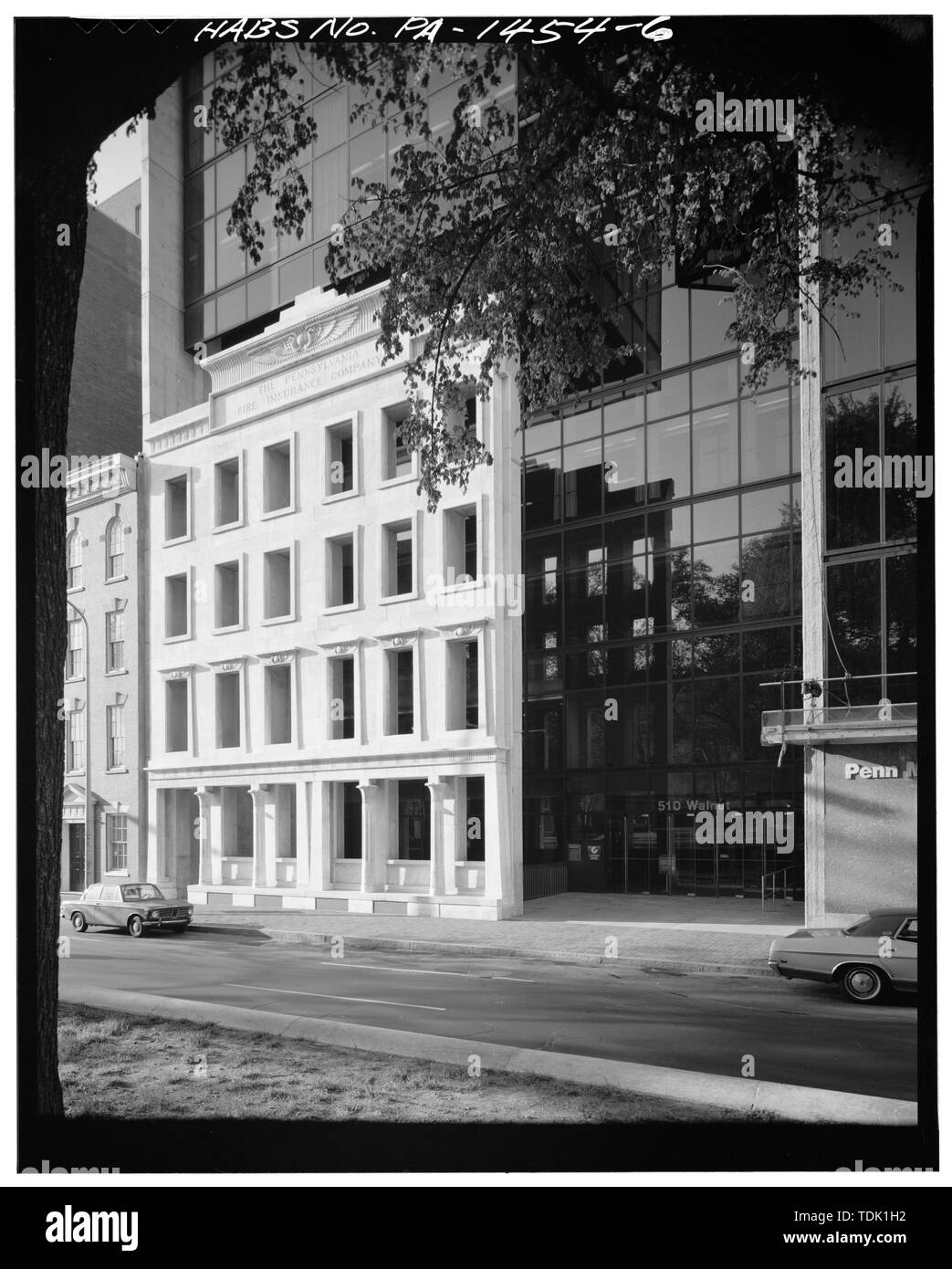 OBLIQUE VIEW SHOWING REFLECTION OF THE FACADE ON THE GLASS WALLS OF THE ...