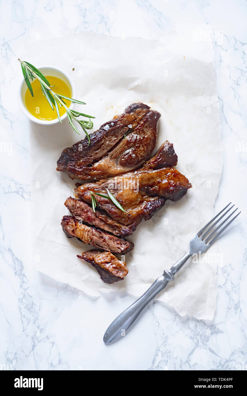 Cooked black angus prime beef steak with rosemary and olive oil on ...
